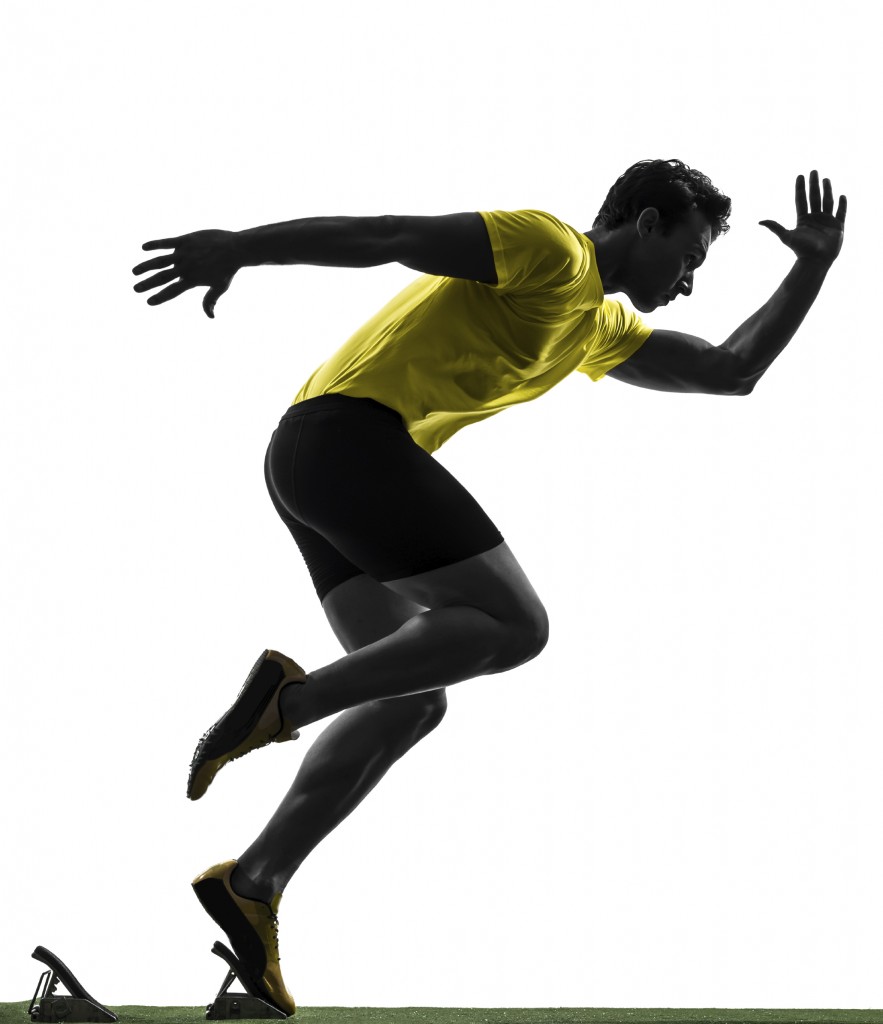 young man sprinter runner in starting blocks | Blue Root Wellness Center